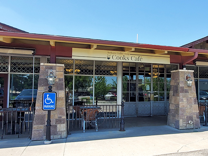 The stone pillars and welcoming entrance of Cook's Cafe stand like sentinels guarding Lincoln's breakfast treasure trove. No password required—just an appetite.