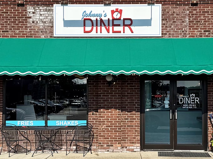 Johnny's Diner welcomes hungry travelers with its classic brick exterior and cheerful green awning – a beacon of breakfast hope on Hudson's main drag. Photo credit: <a href="https://www.google.com/maps/contrib/106209191758283898444/photos/@41.3503,-81.4627646,11z/data=!3m1!4b1!4m3!8m2!3m1!1e1?entry=ttu&g_ep=EgoyMDI1MTAxMi4wIKXMDSoASAFQAw%3D%3D" target="_blank" rel="noopener noreferrer">Keith Thompson</a>