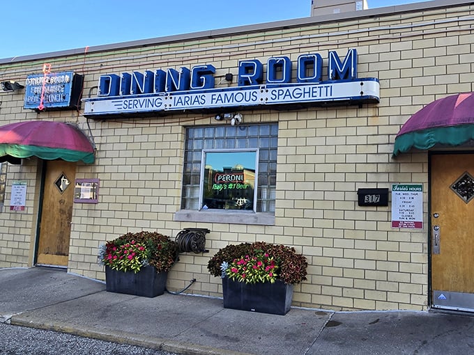 The unassuming brick exterior of Iaria's, with its vintage "DINING ROOM" sign, proves that the best Italian restaurants often hide in plain sight.