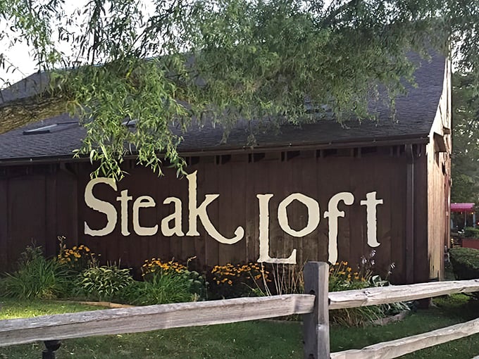 That rustic wood-paneled exterior practically whispers "great steak inside" – and it's not lying to you.
