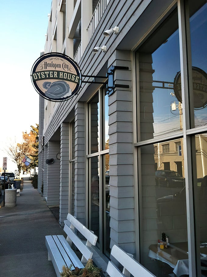 That iconic circular sign promises oceanic treasures within—like a wax seal on an invitation to the best party in town.