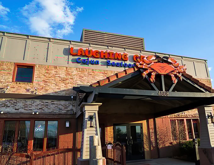 The giant red crab perched atop Laughing Crab's entrance isn't just decoration—it's a siren call to seafood lovers across Iowa's cornfields.