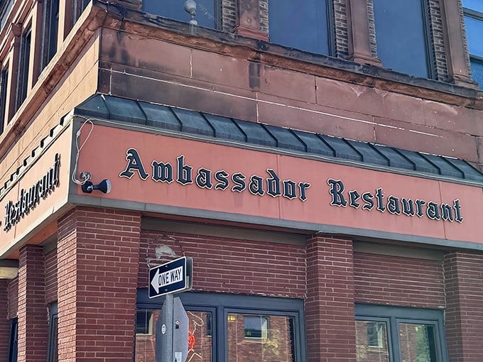 The Ambassador's classic brick facade and vintage signage isn't trying to impress anyone—it doesn't need to. What awaits inside will do all the talking.