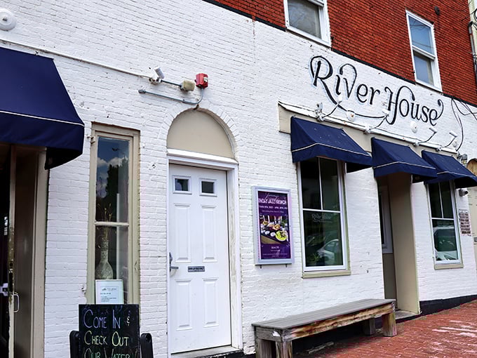 The unassuming white brick façade of River House belies the seafood treasures within. Those navy awnings hint at maritime delights to come.