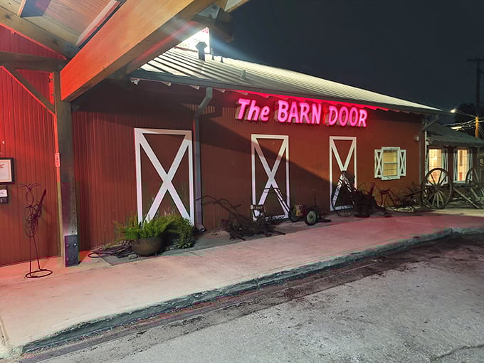 That red barn exterior isn't just for show – it's a promise of honest-to-goodness Texas steakhouse tradition waiting inside.
