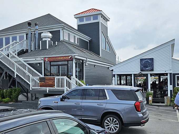 The gray-sided building with its cheerful red sign stands like a beacon for crab lovers—a waterfront temple to Maryland's most sacred culinary tradition.