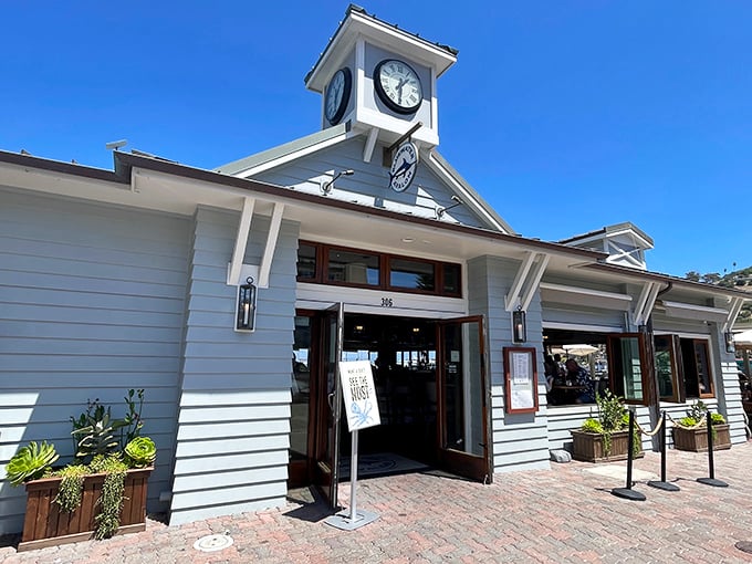 The iconic clock tower entrance stands like a maritime timekeeper, reminding visitors it's always the right hour for fresh seafood.