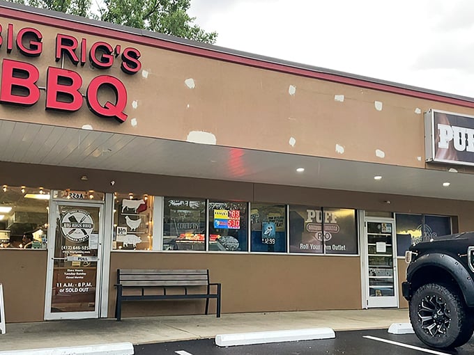 The unassuming tan façade with bold red lettering says everything you need to know: this place prioritizes smoke over style. Culinary treasures often hide in plain sight.