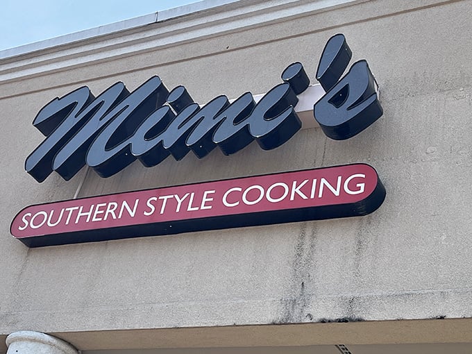 That classic blue script against beige brick announces what locals already know—this isn't just a sign, it's a beacon of Southern comfort for Lexington's comfort food pilgrims.