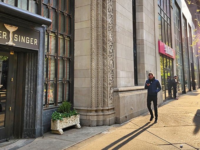 The elegant exterior of Butcher and Singer beckons like a time portal to old Hollywood. That cocktail glass logo isn't just signage—it's a promise of sophistication awaiting inside.