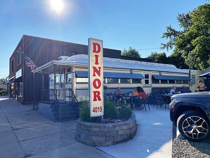 That iconic vertical "DINOR" sign isn't a typo—it's pure Erie, Pennsylvania tradition standing proud against the blue sky.