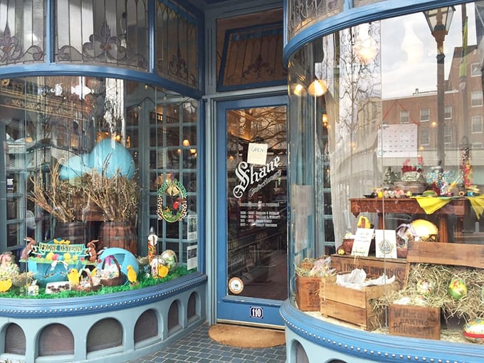 The blue storefront of Shane Confectionery isn't just eye candy—it's a portal to a sweeter time when Easter displays were works of art and window shopping was an actual pastime. 