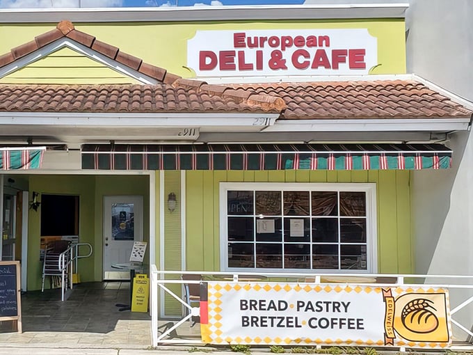That cheerful yellow exterior isn't just paint – it's a promise of the butter-laden treasures waiting inside.
