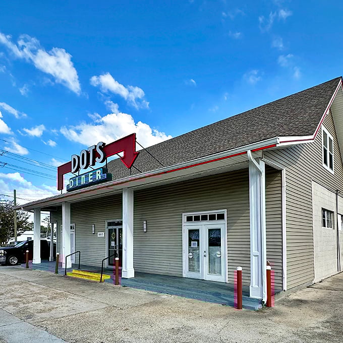 The iconic red sign beckons like a lighthouse for hungry souls. Dots Diner's unassuming exterior houses breakfast treasures that locals have cherished for generations.