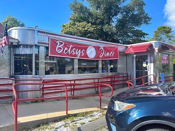The gleaming stainless steel exterior of Betsy's Diner shines like a beacon of hope for the hungry. That red awning practically screams "comfort food ahead!"