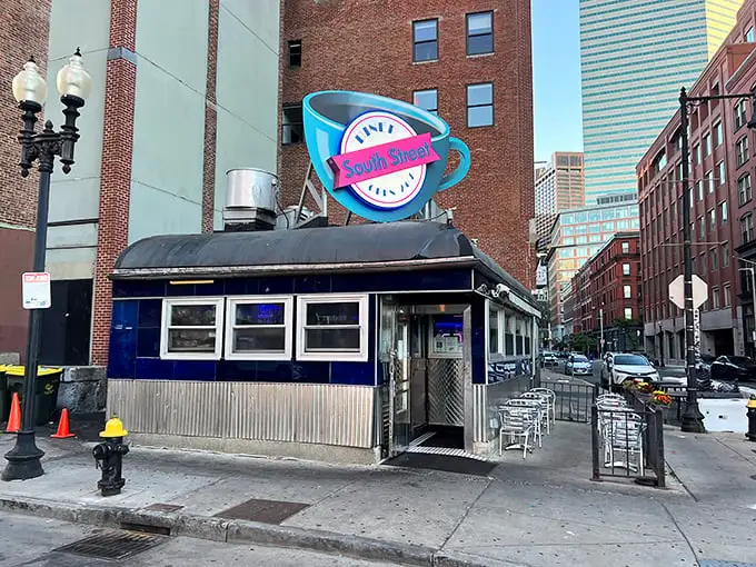 That iconic blue coffee cup sign isn't just neon—it's a beacon of hope for hungry night owls across Boston's Leather District.