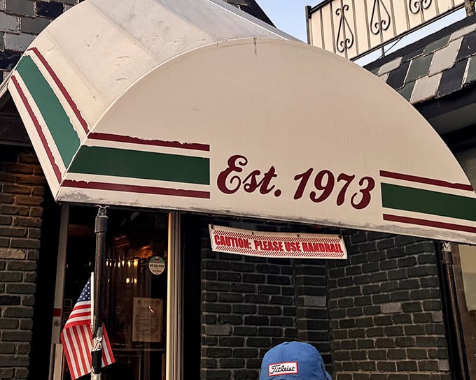 That iconic green and burgundy awning isn't just decoration—it's a portal to a time when diners were the cornerstone of American social life.