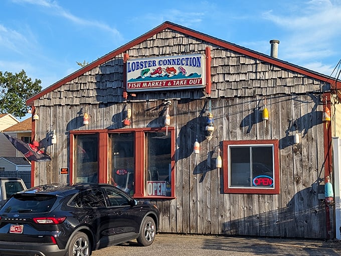 The weathered cedar shakes and colorful buoys aren't just rustic charm—they're a seafood promise waiting to be kept.