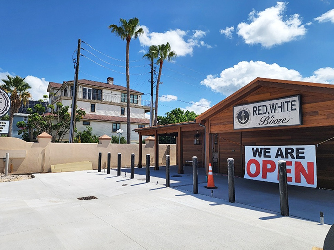 The Florida sun plays spotlight on this unassuming seafood sanctuary, where the "WE ARE OPEN" sign might as well read "PARADISE FOUND."