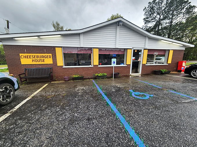 The unassuming brick exterior with bright yellow shutters stands as a testament that culinary greatness often hides in plain sight.