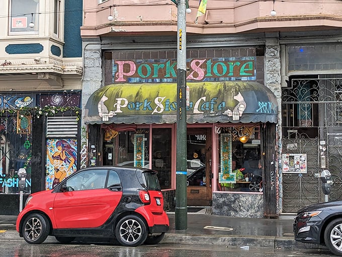 The weathered awning and colorful facade of Pork Store Cafe stands as a beacon of breakfast hope on Haight Street, a culinary time capsule in a rapidly changing city.