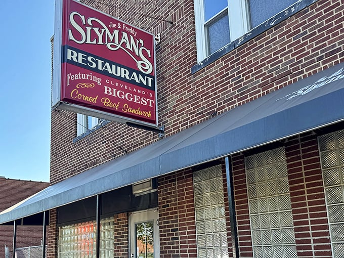 The iconic red sign beckons like a lighthouse for sandwich lovers, promising Cleveland's biggest corned beef creation behind those brick walls.