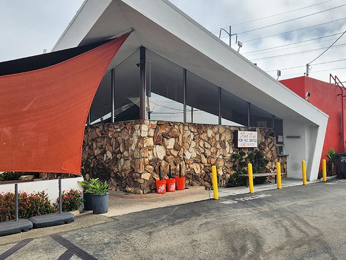 The iconic Googie architecture of Pann's stands like a mid-century time machine, its angular roof and stone facade beckoning hungry time travelers from across Los Angeles.