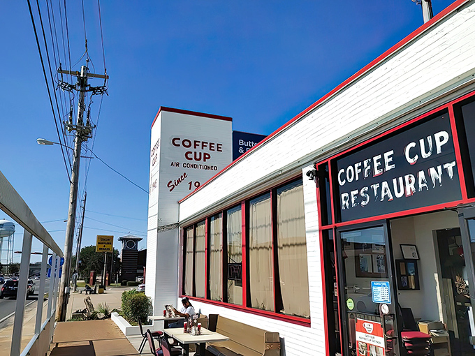 The Coffee Cup Restaurant’s simple white exterior with red trim reflects its old-school charm, where the focus is on hearty plates and timeless diner tradition.