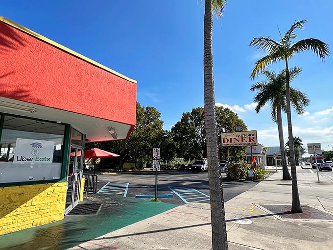 The iconic coral-red facade of Jimmy's stands out against Miami's blue sky like a beacon calling all breakfast lovers home.