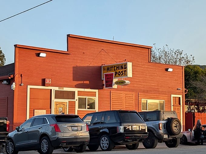 The terracotta-colored exterior of Hitching Post stands like a beacon for meat lovers, promising old-school charm and legendary steaks in the quiet town of Casmalia.