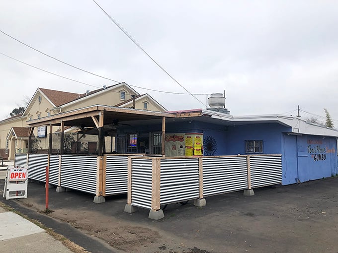 From the street, Tori's Place looks like a humble blue oasis, complete with covered patio seating—a culinary treasure hiding in plain sight.