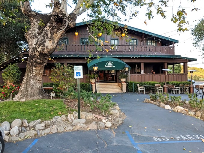 The majestic sycamore stands guard over this historic Route 66 steakhouse, where prime rib legends and California history converge.