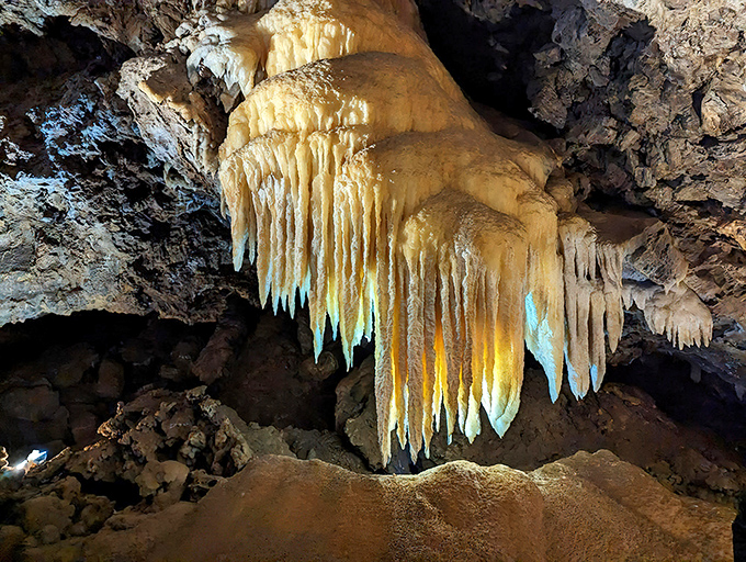 Nature's own chandelier shop! These golden stalactites have been slowly crafting their masterpieces for thousands of years, one drip at a time.