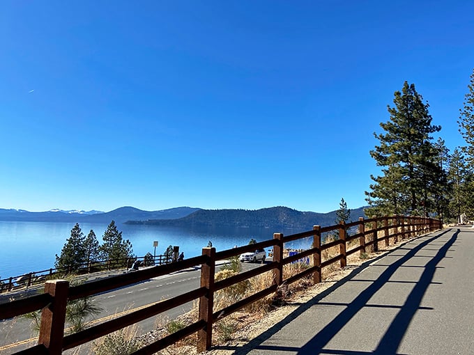 That wooden fence isn't just protecting you from the edge—it's framing one of nature's greatest masterpieces perfectly.