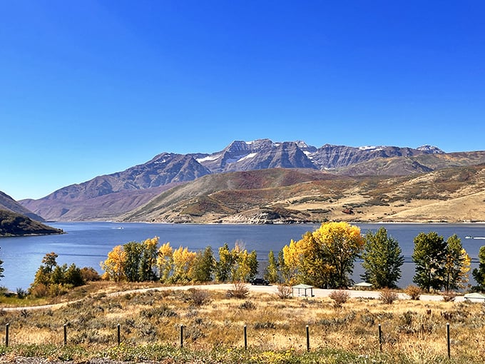 Mother Nature showing off her best work—rolling hills, majestic mountains, and spring greenery create Utah's perfect postcard moment.