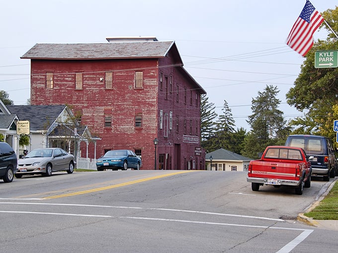 The iconic red mill building stands as a sentinel of Tipp City's past, where history isn't just preserved—it's lived in daily.