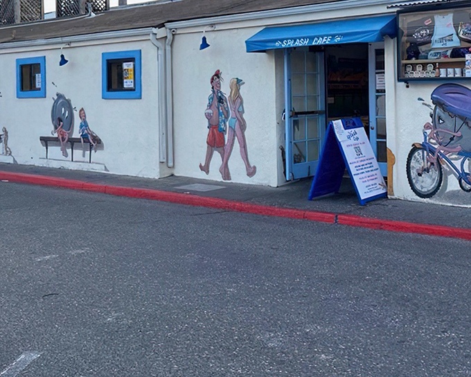 The whimsical exterior of Splash Café looks like a beach postcard come to life, complete with playful murals that set the perfect tone for the seafood adventure within.