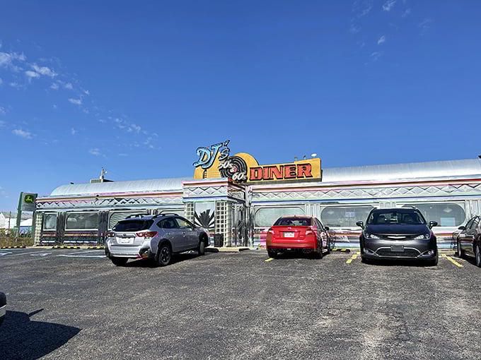 The gleaming silver exterior of DJ's 50's & 60's Diner shines like a beacon of nostalgia against the West Virginia sky, promising a time-traveling culinary adventure inside.