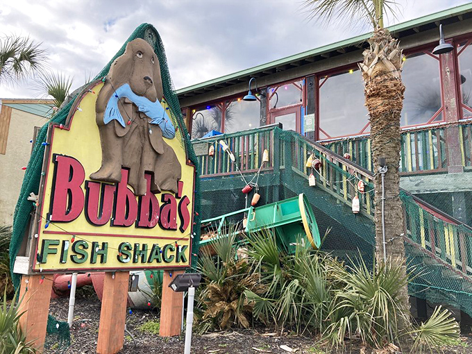 That iconic manatee mascot clutching a fish tells you everything – this isn't fancy dining, it's seafood paradise wrapped in weathered wood and coastal charm.