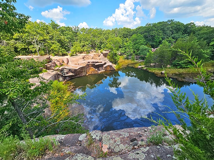 Nature's mirror game at its finest – the quarry pond reflects clouds so perfectly you'll wonder which way is up at Elephant Rocks State Park.