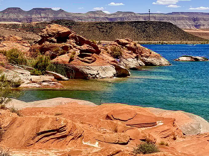 Where fiery red sandstone meets crystal blue water, creating nature's most dramatic color contrast. Mother Nature showing off her interior design skills.