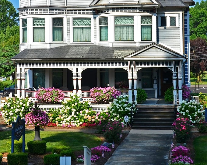 The grand entrance to Victorian splendor – where modern stress dissolves faster than an aspirin in hot tea. Those bay windows practically beg you to sit and gossip about the neighbors.