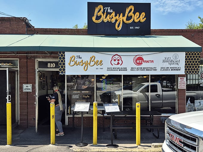 The unassuming brick exterior of Busy Bee Café hides Atlanta's soul food treasure. That bench outside has witnessed countless hungry patrons waiting their turn for greatness.