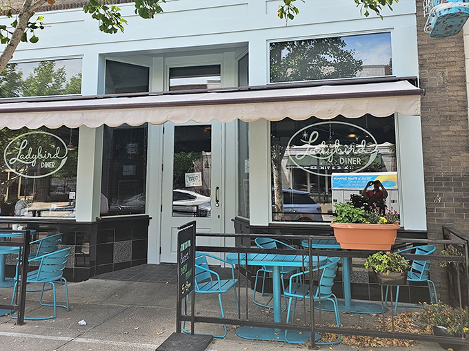 That mint-blue exterior isn't just pretty—it's a beacon of hope for hungry souls wandering Massachusetts Street in search of breakfast salvation.