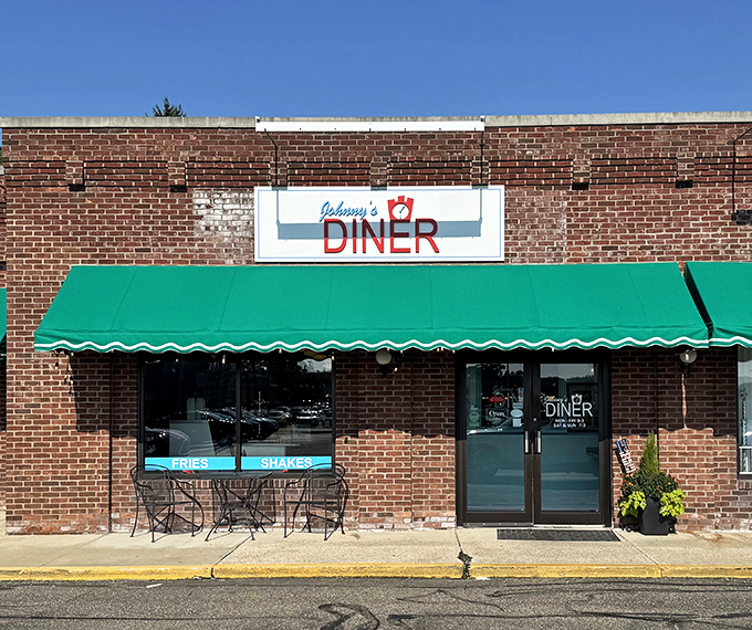 Johnny's Diner welcomes you with its classic brick facade and emerald green awning – a time capsule of Americana waiting to be discovered.