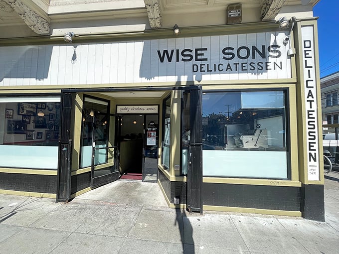 Sunshine bathes the classic delicatessen façade, where hungry San Franciscans line up for their bagel fix. Some traditions are worth preserving, especially when they taste this good.