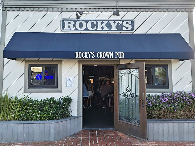 That blue awning isn't trying to impress anyone – it's too busy hiding burger greatness inside this Pacific Beach gem.