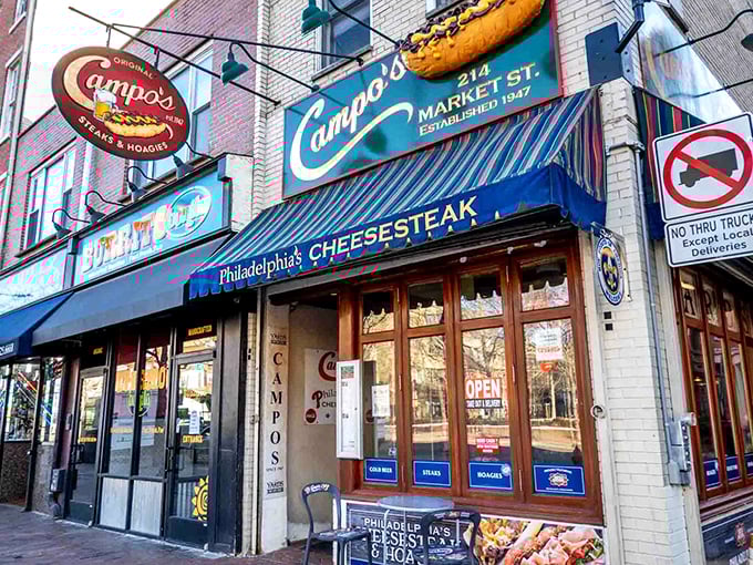 Campo's iconic blue awning and vintage sign stand as a beacon for cheesesteak pilgrims in Old City Philadelphia, promising authentic flavors just steps from Independence Hall.