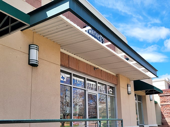 Wayne's exterior might be modest, but that "TEXAS BBQ" sign is making promises that your nose will soon confirm aren't empty.