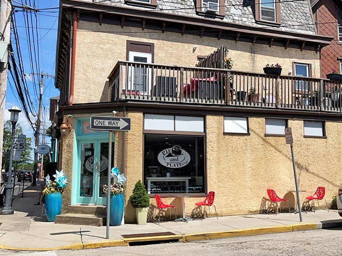That turquoise door isn't just an entrance—it's a portal to flaky, buttery happiness disguised as a corner cafe.